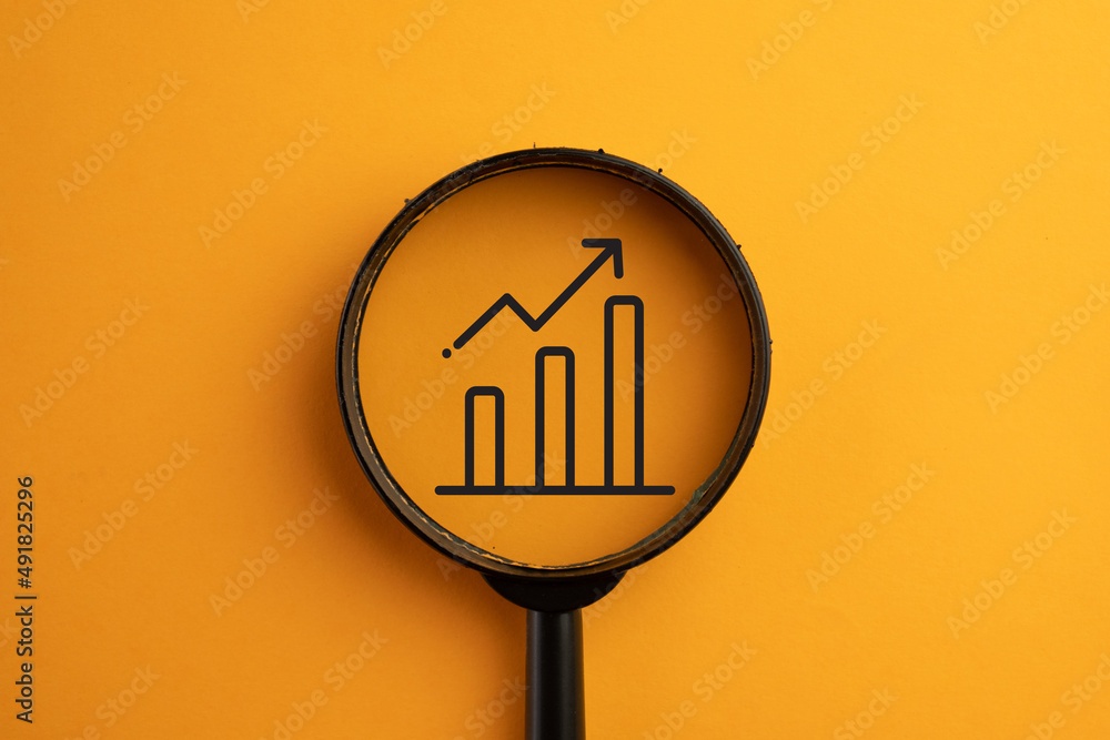 Growthing Bar concept.,View through a magnifying glass on growthing ...