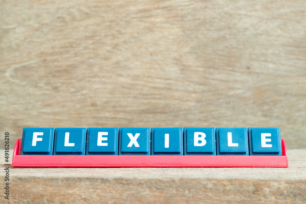 Tile alphabet letter with word flexible in red color rack on wood ...