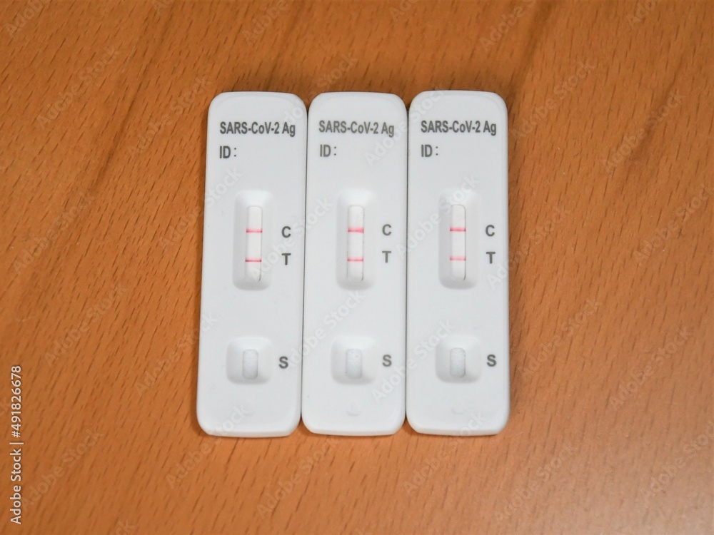 Three positive COVID-19 antigen, lateral flow, self tests. White tests ...