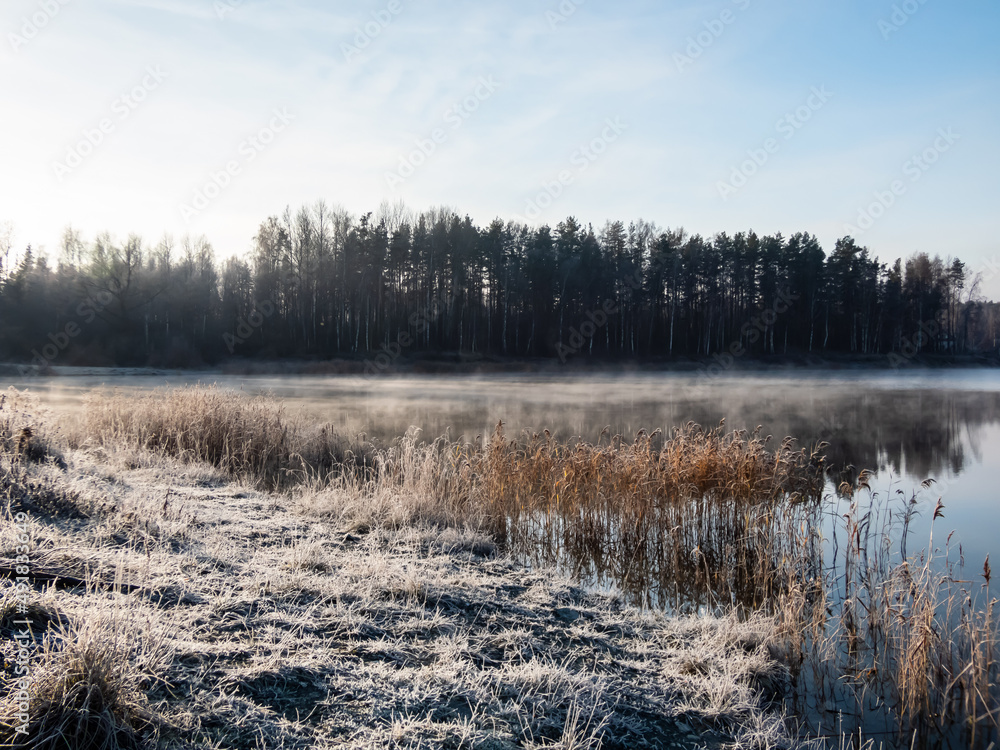 Beautiful early winter morning scenery of landscape of a lake with ...