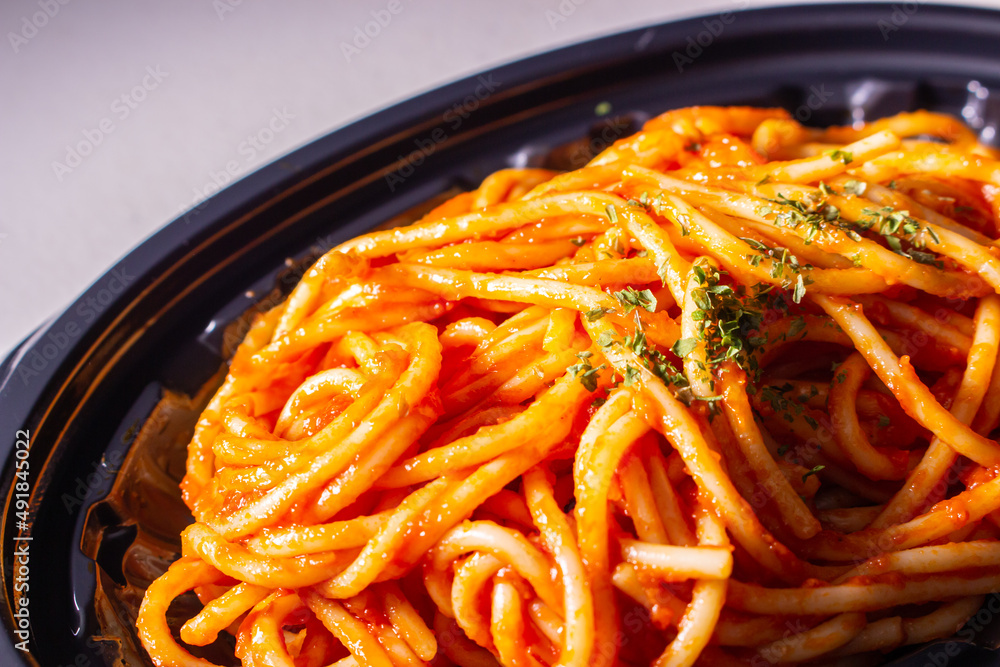 Closeup takeout Japanese Naporitan Spaghetti in the food tray ...