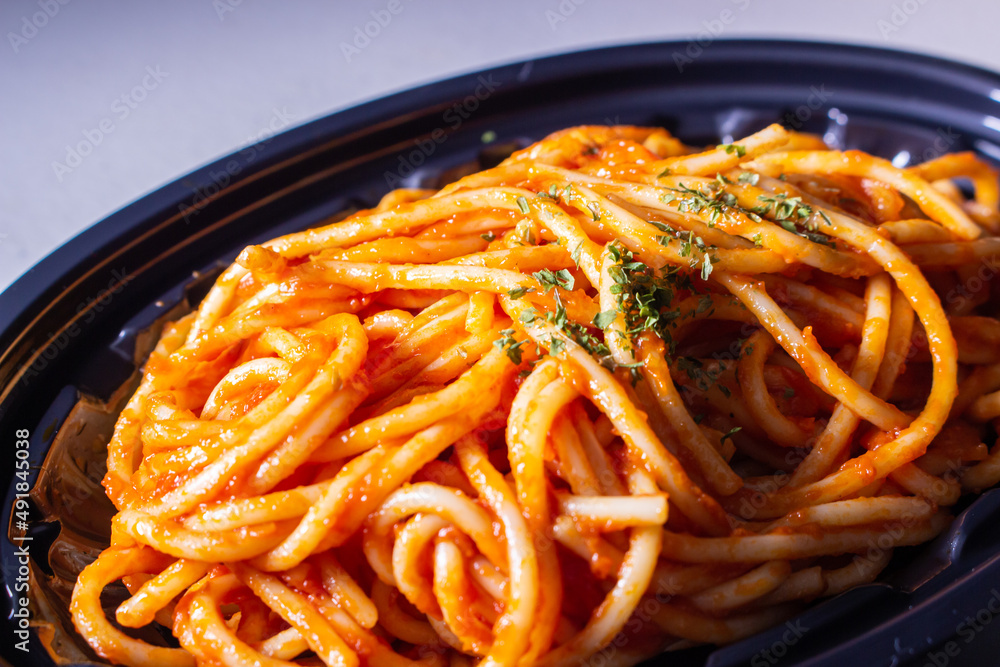 Closeup takeout Japanese Naporitan Spaghetti in the food tray ...