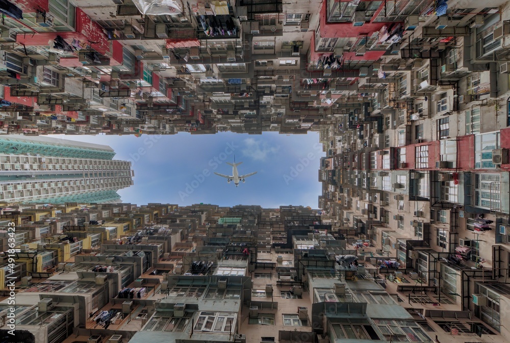 The Monster Building (Montane Mansion), with a jet plane flying ...