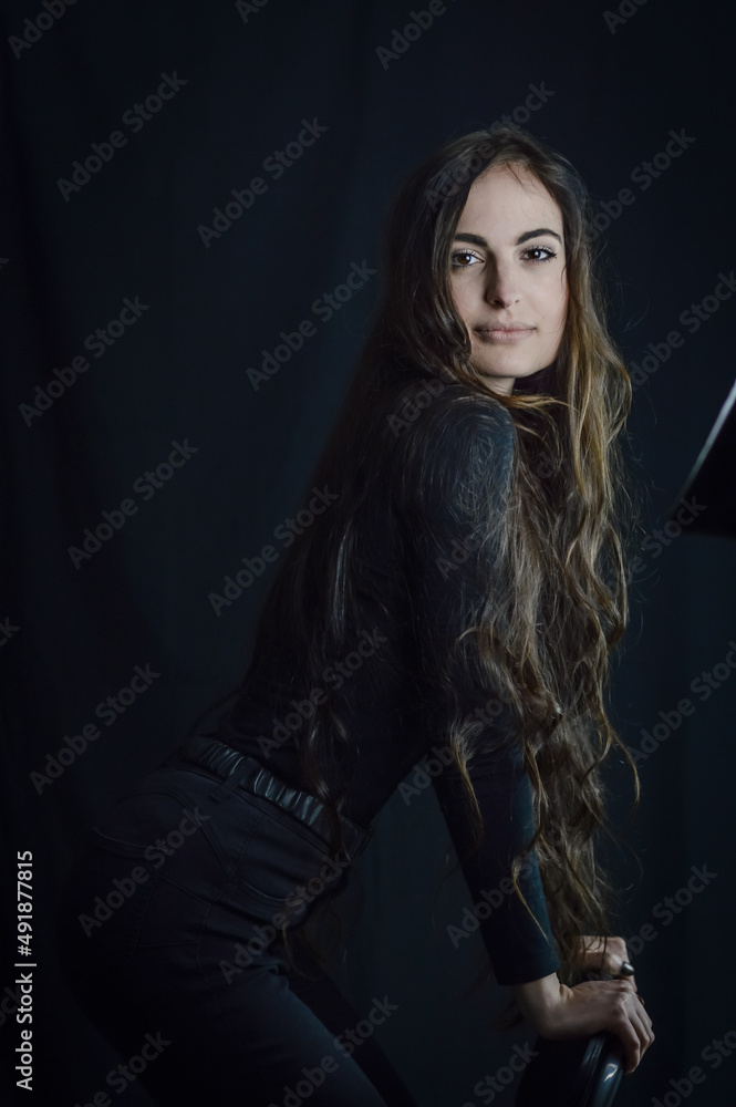 Poster Portrait of a beautiful young Italian woman with very long hair ...