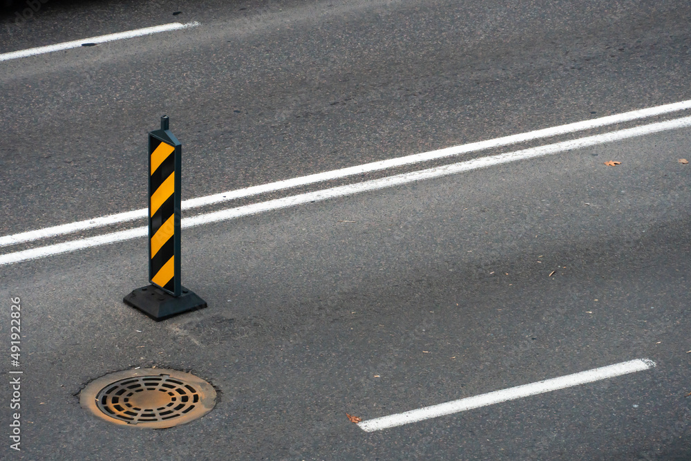 A road sign indicating the separation of traffic flows in front of a ...