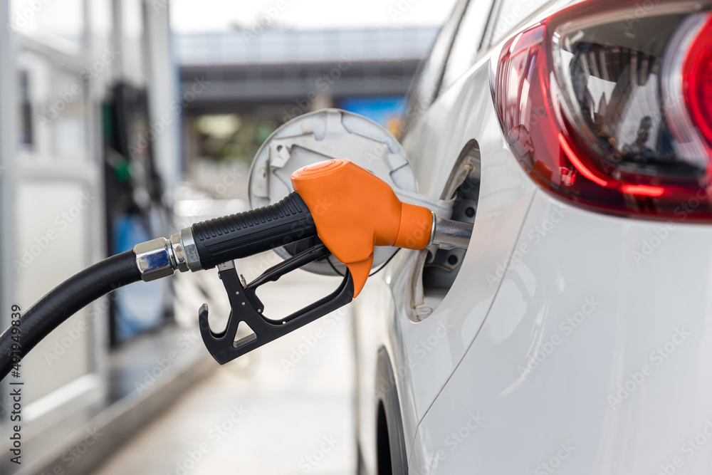 Refill and filling Oil Gas Fuel at station. Gas station refueling. To ...
