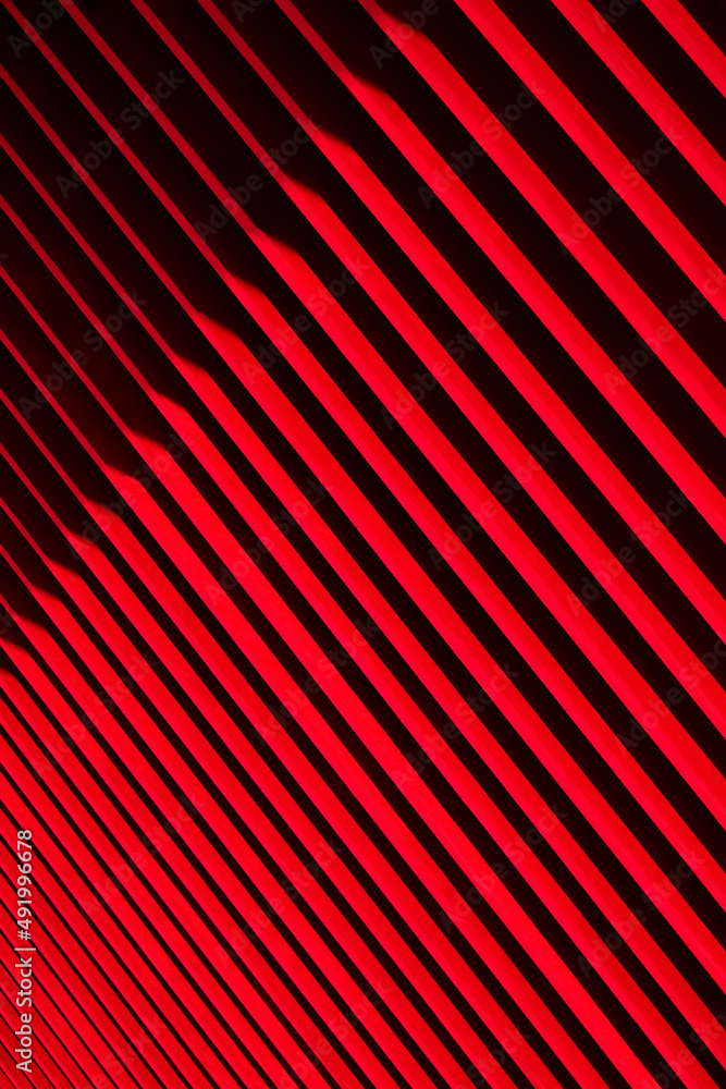 Abstract background design of light and shadow on red battens lines ...