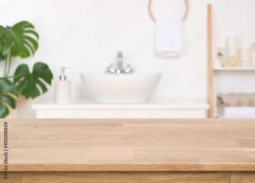 Wooden counter on blurred bathroom background, design key visual layout ...