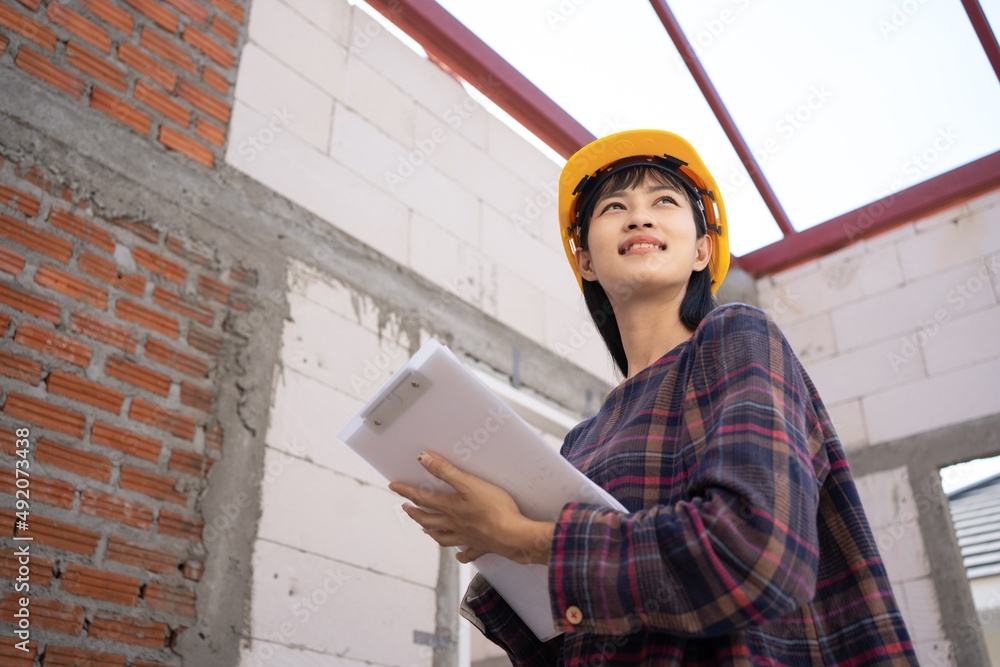 Female Asian,Beautiful Engineer,Architecture Smile and holding a ...