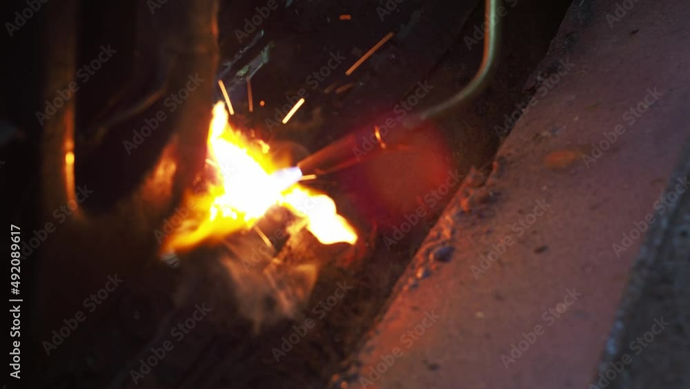 cutting metal with a gas burner. a man cuts metal. cutting with propane ...
