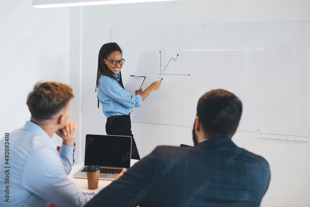Emotional female laughing while explaining informative strategy for ...