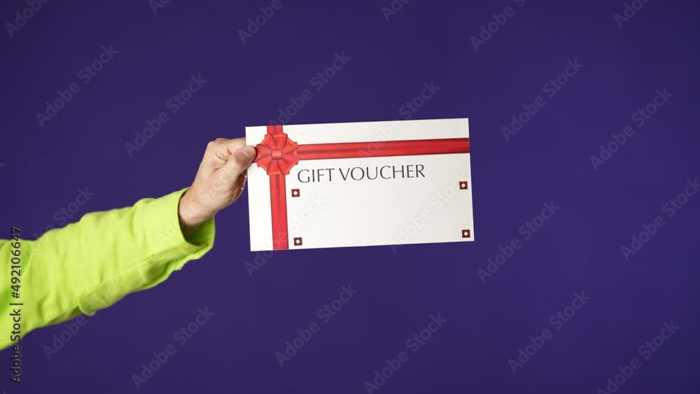 Close crop of male hand hold gift certificate card coupon voucher with ...