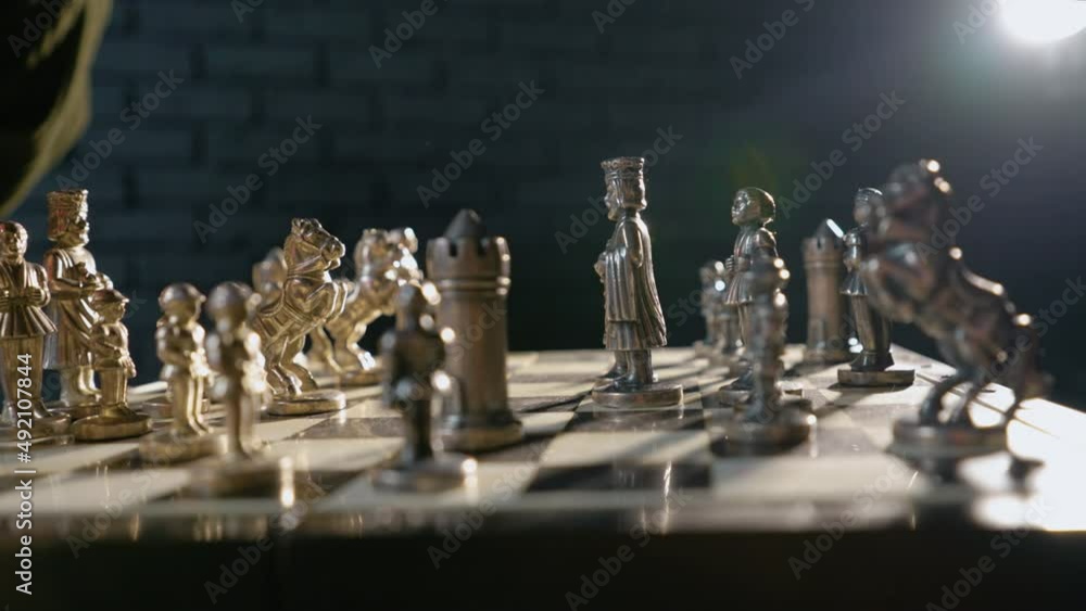 Chess game. Strategy sports game. Girl rotates figure of king. Chess ...