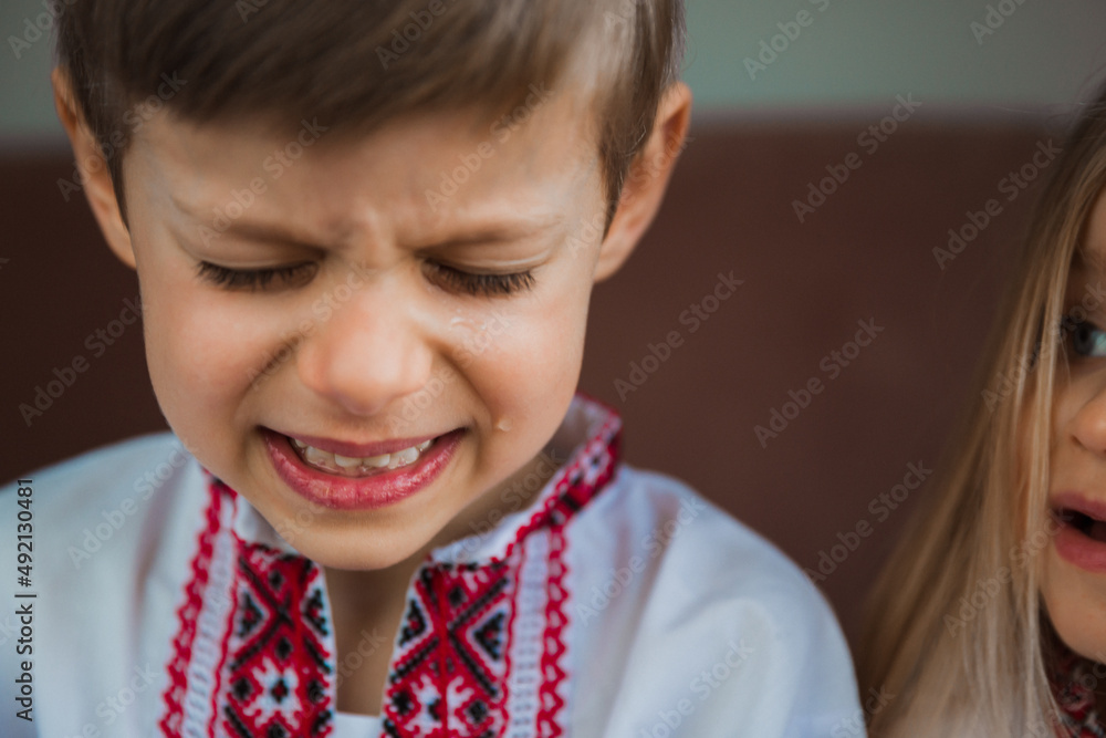 Young blond ukrainian child, havy cry , no war wanted, kid wishing ...