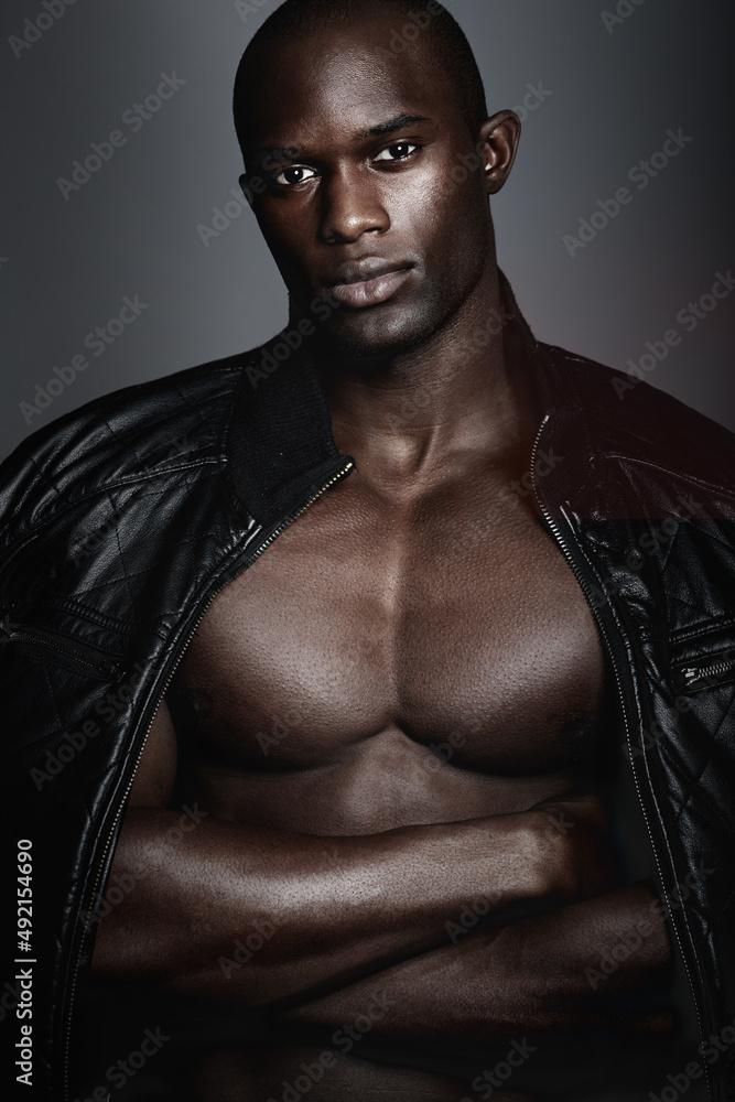 He is the picture of strength. A handsome african man modeling clothes ...