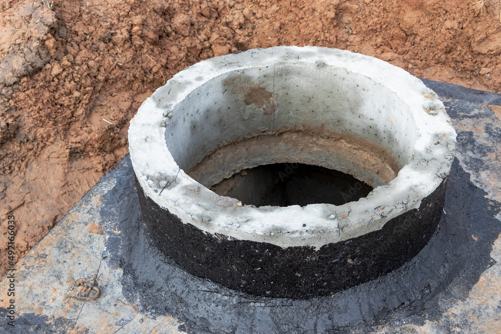 Installation of a reinforced concrete well for water supply and ...