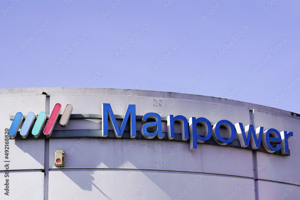 manpower sign brand and text logo of employment staffing people firm ...