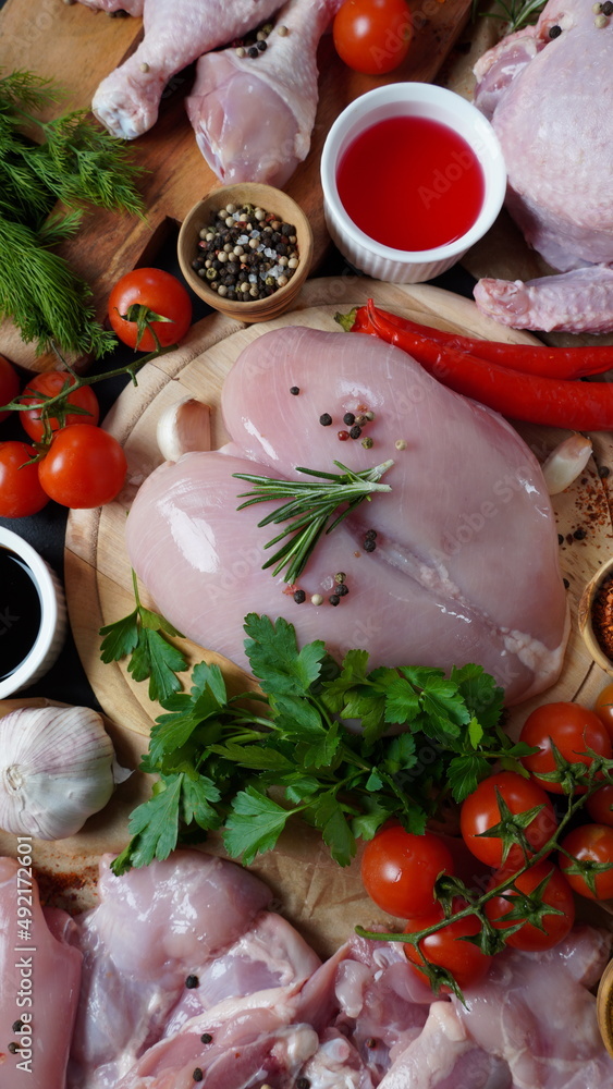 Different types of fresh chicken meat. Whole raw chicken, fillet, thigh ...