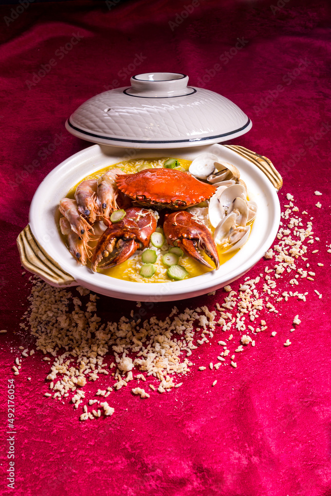 stewed mixed seafood platter crab, shell clam, tiger prawn in hot clay ...