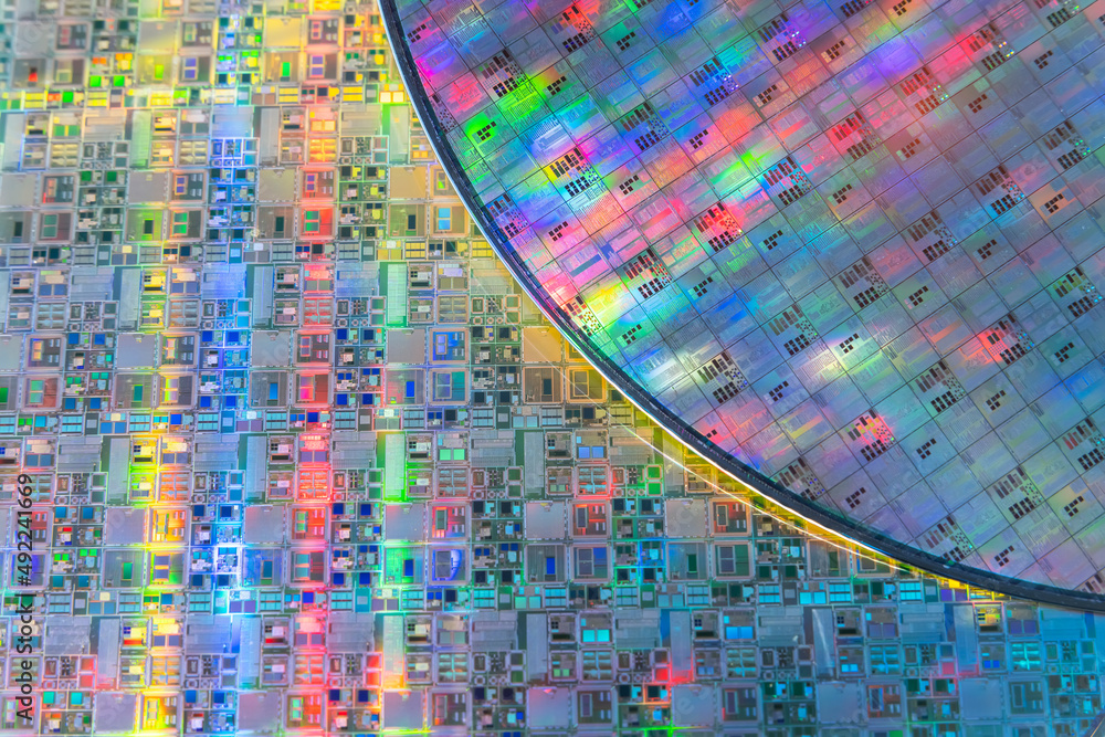 silicon wafer with microchips reflecting different colors. Stock Photo ...
