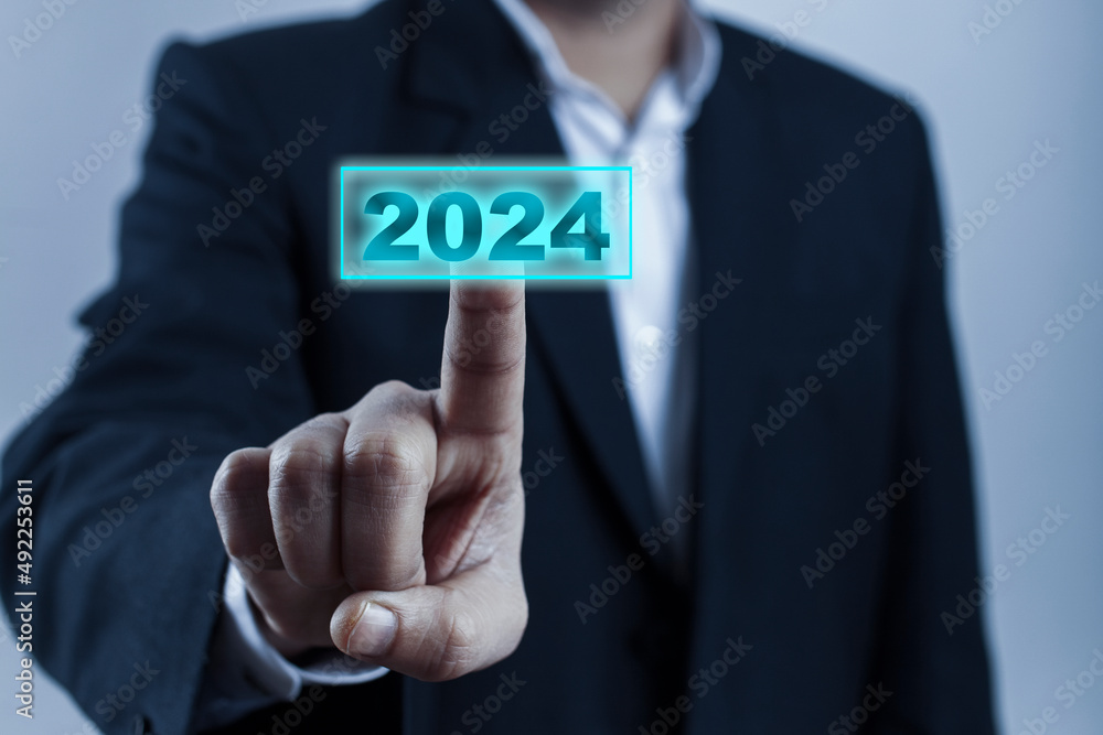 man hand touching on 2024 calender year button Stock Photo | Adobe Stock