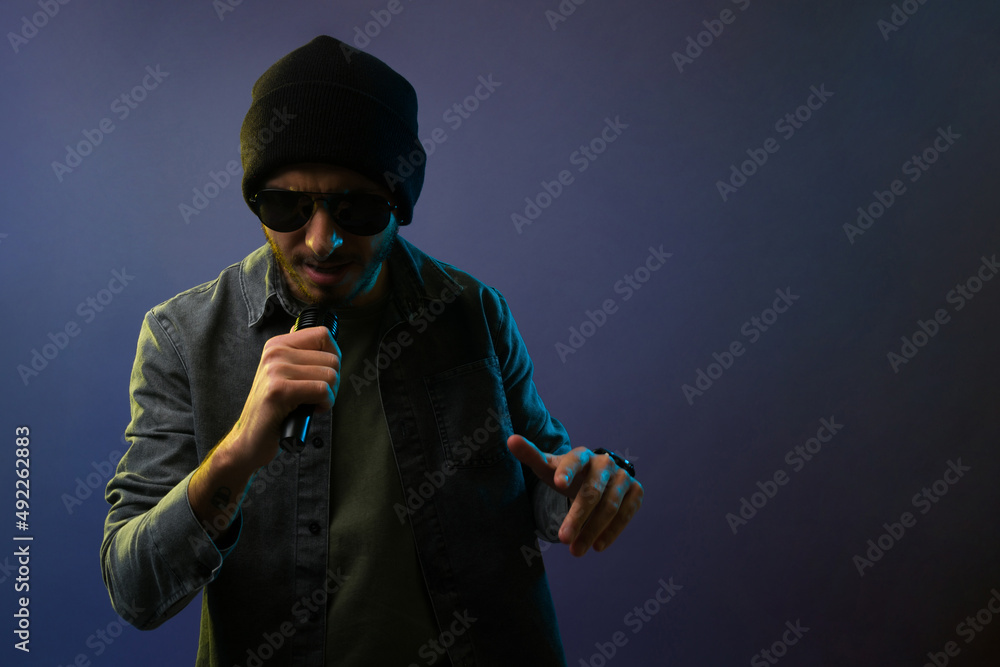 Rap singer rehearsing with a microphone Stock Photo | Adobe Stock