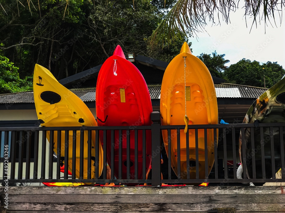 Redang Island Malaysia Colourful kayaks, boats and canoes stacked up ...