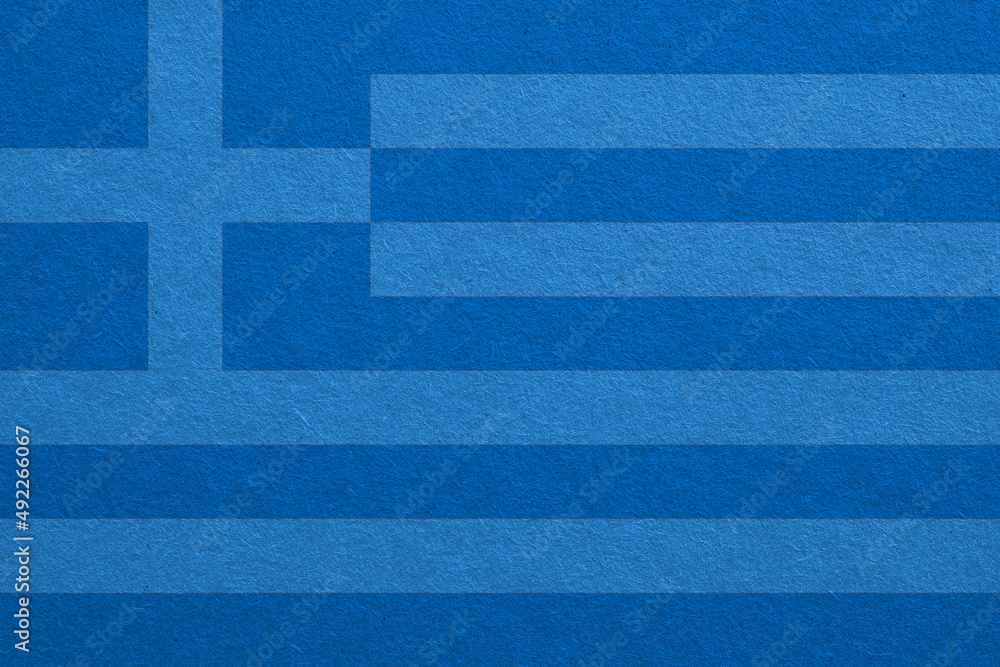 Greek flag outline on blue cardboard surface. Paper texture with ...