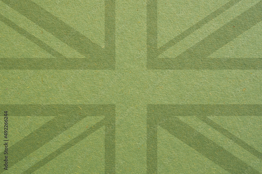 British flag outline on green cardboard surface. Inverted view. Paper ...