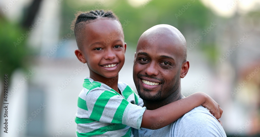 Father and son doing eskimo kiss. African black dad and child bonding ...