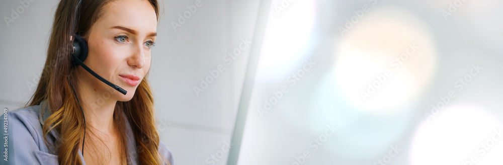 Business people wearing headset working in office in widen view to ...