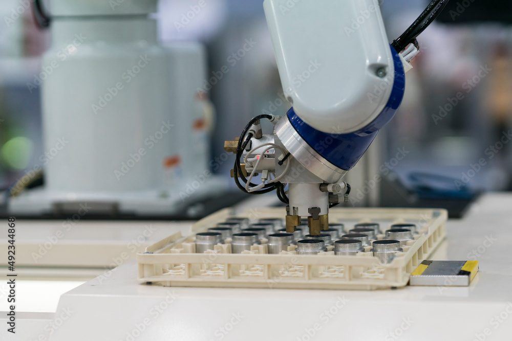 Robot arm auto load and unload CNC turning part Stock Photo | Adobe Stock