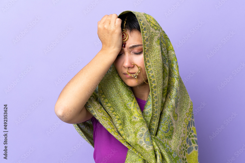 Indian woman isolated on purple background with headache Stock Photo ...