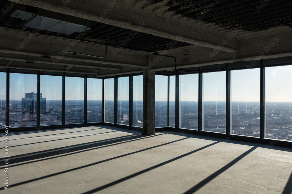 Angle view of empty office space in a tall highrise awaiting ...
