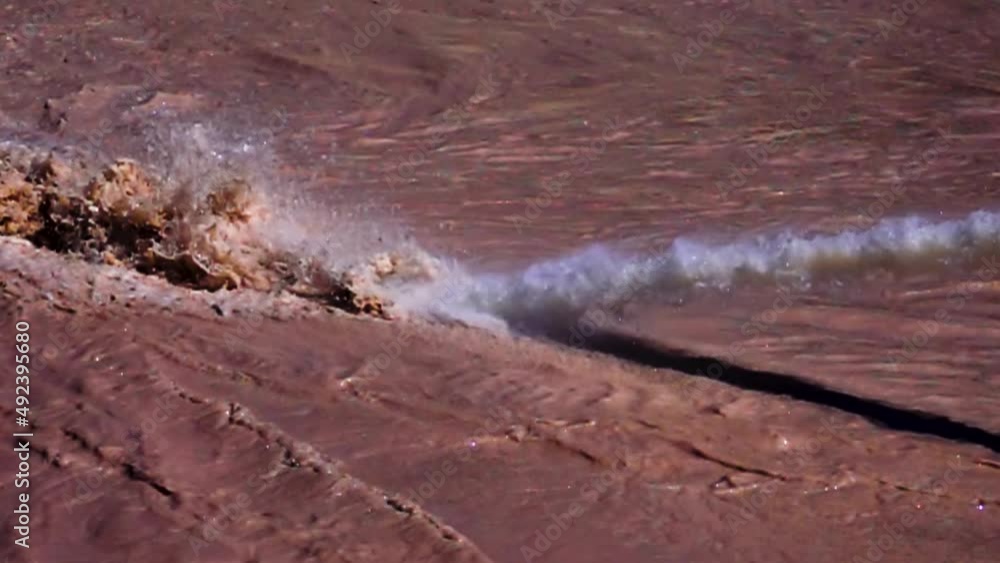 Stockvideon Foamy muddy water gushes out of the pipe under high ...