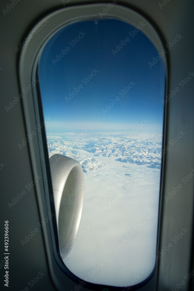 GREENLAND - 10 MAY 2018: View from the large plane window of a modern ...