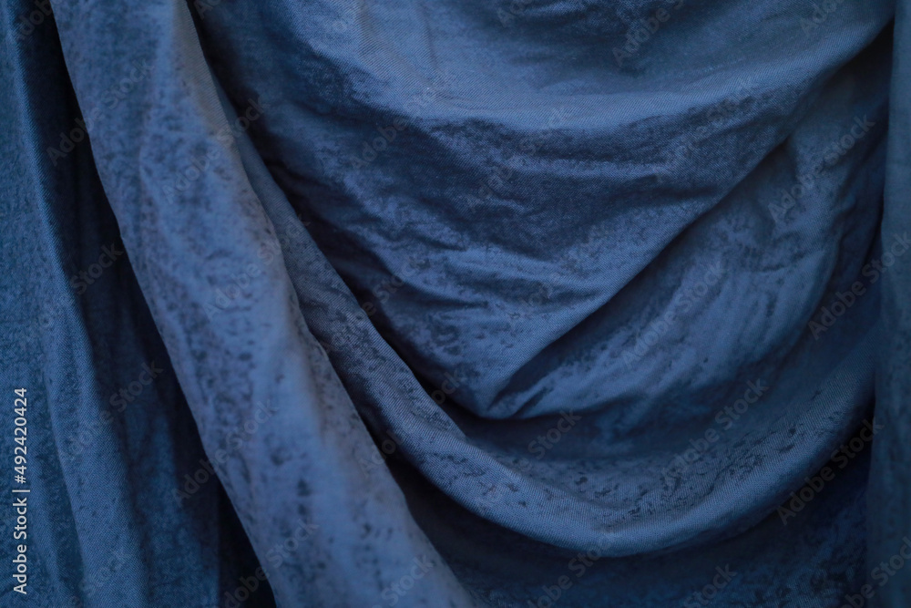 Wet drying bed linen. Background of green crumpled fabric with pleats ...