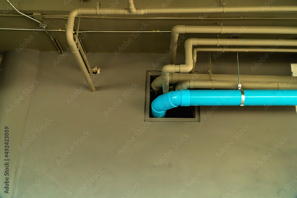 The location of the plumbing connection point is the large blue PVC ...