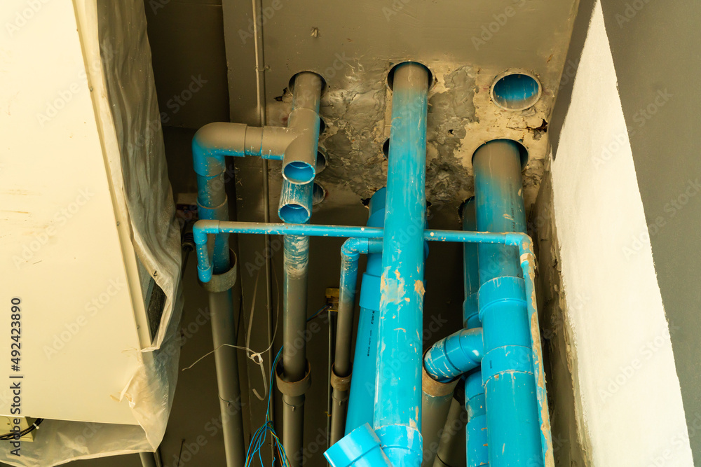 The location of the plumbing connection point is the large blue PVC ...