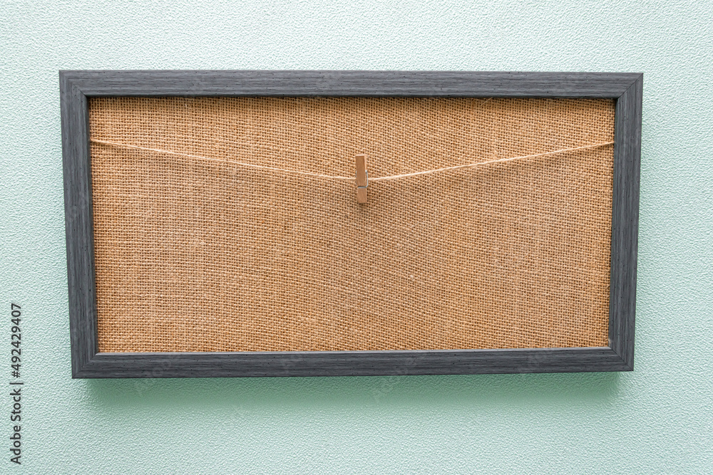 cork bulletin board with a rope and 1 clothespin in a gray frame ...