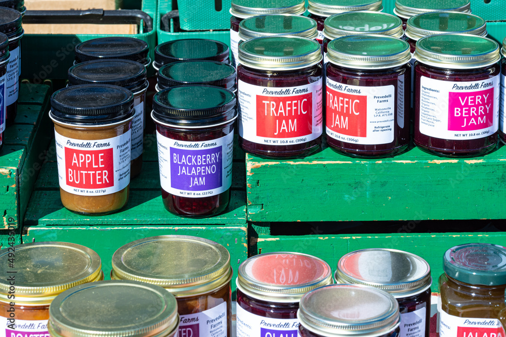 jars of artisan made jams in various flavors as labeled from small ...