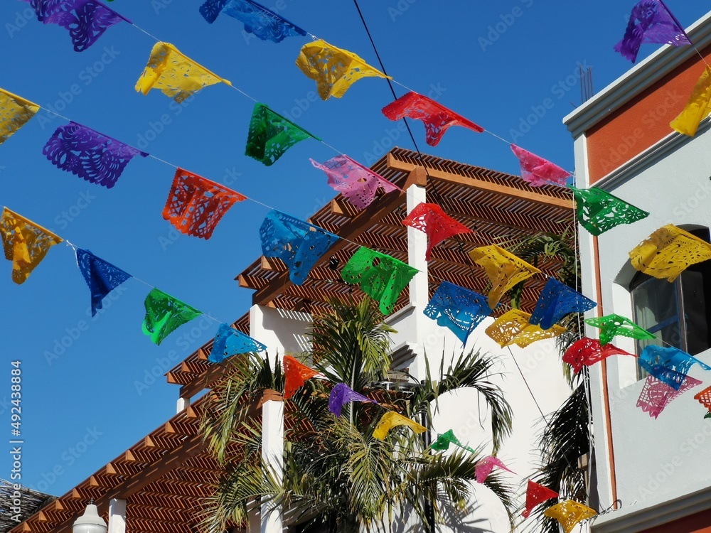 banderas de papel picado en calle. Stock Photo | Adobe Stock