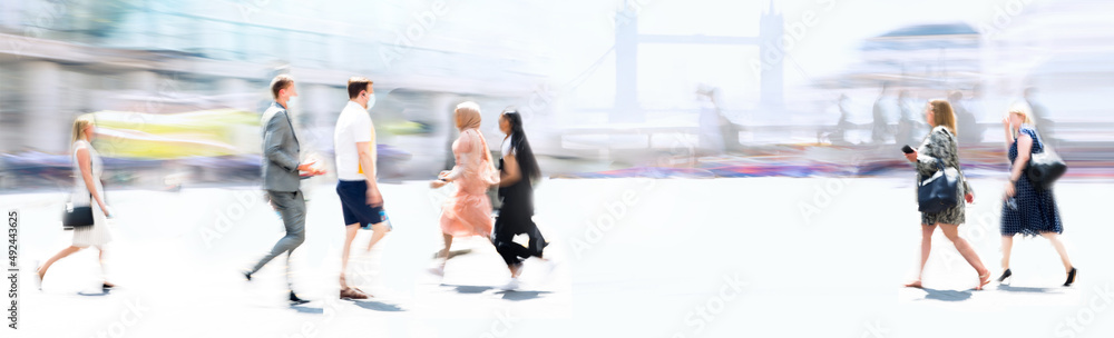 People walking in the City, blurred wide background representing modern ...