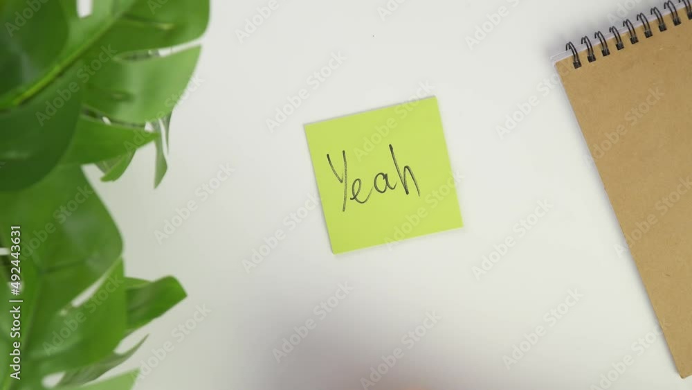 YEAH. congratulations Top view write with a pen on a sticker. Put a ...