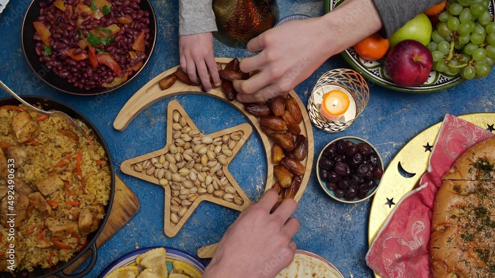 Ramadan iftar Eid. Muslim family has dinner at home. Table with ...