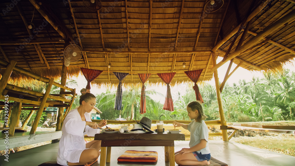 The happy family eat and drink tasty beverages spending time in local ...