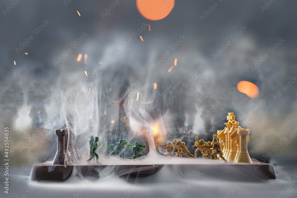 War concept. Silhouettes of soldiers on chessboard. War Concept ...