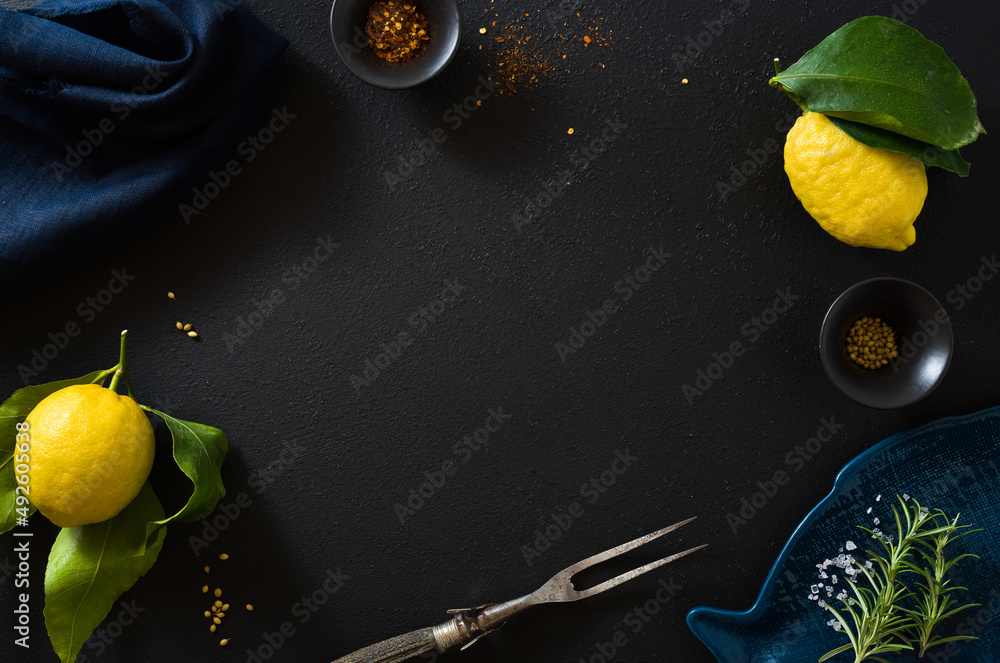 empty black food background with lemons for writing text or advertising ...