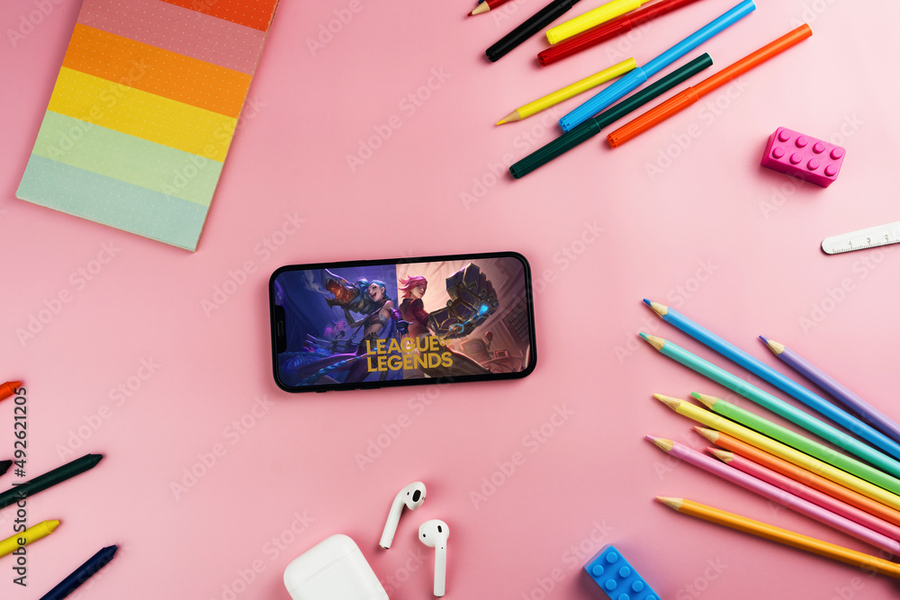 League of Legends (LOL) mobile game app on the smartphone screen. Pink ...