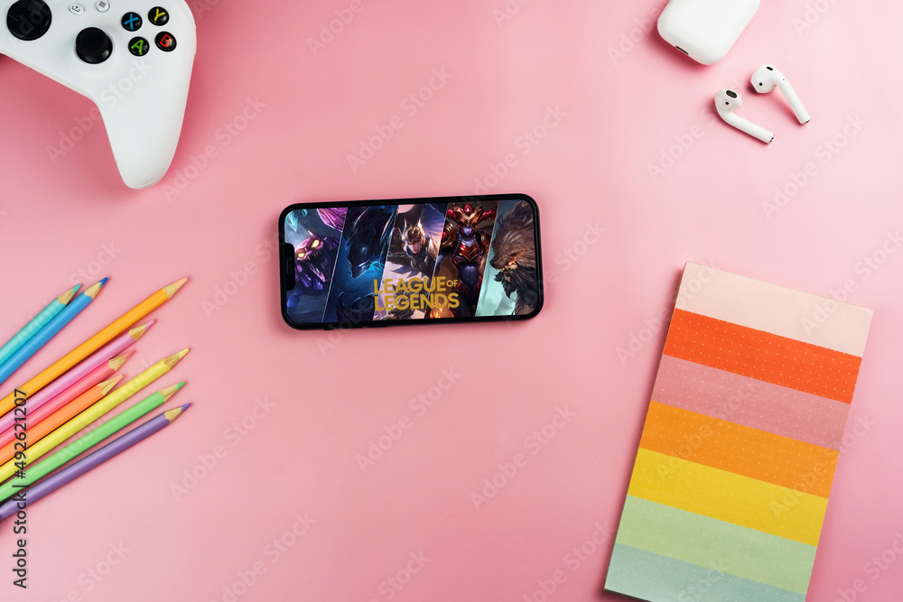 League of Legends (LOL) mobile game app on the smartphone screen. Pink ...